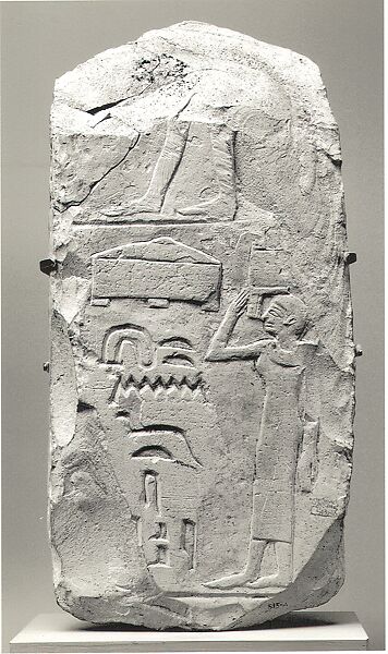 Relief depicting a female offering bearer and with inscription ...